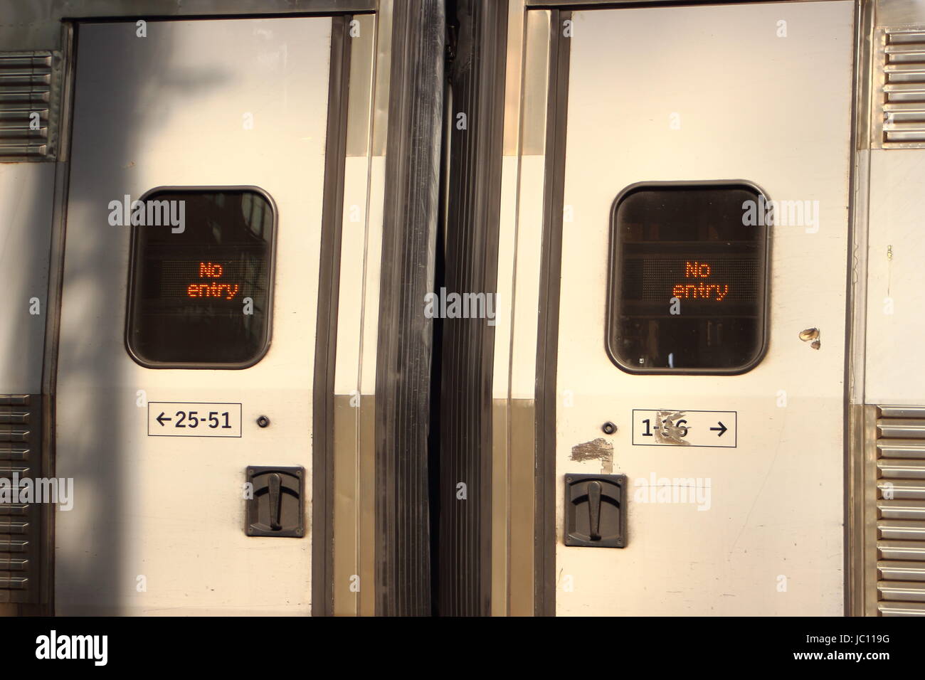 Closed sliding train doors with No Entry sign Stock Photo - Alamy