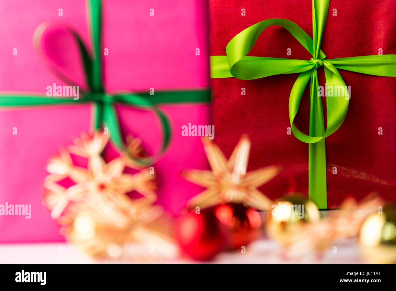 An emerald ribbon and crimson box in the background contrasting with ...