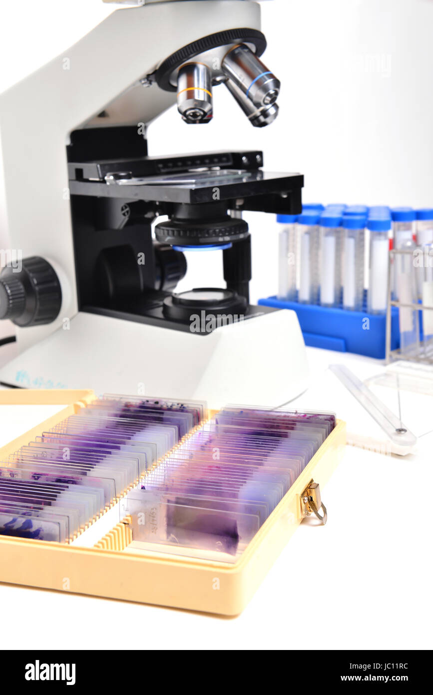 microscope with laboratory equipment on white background Stock Photo ...