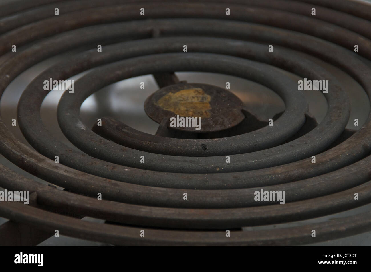 A coiled electric heating element on a modern stove up close Stock ...