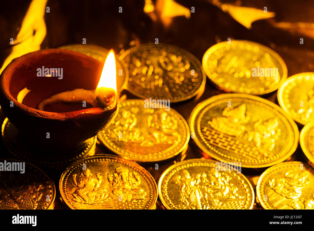 Close-up Indian Festival Diwali Gold-Coin With Oil-Lamp Burning Nobody ...