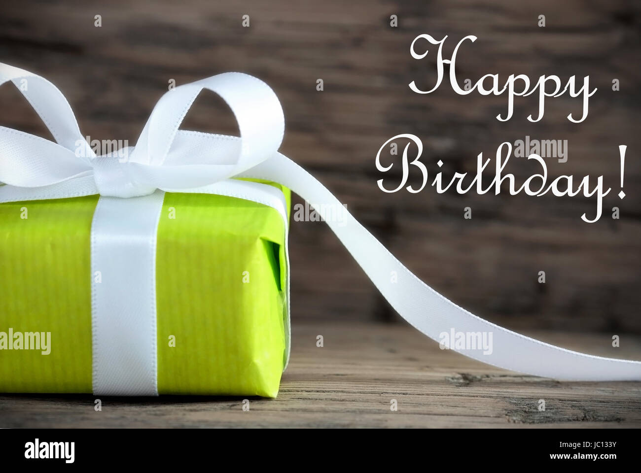A Green Present with the Words Happy Birthday, on Wooden Background ...