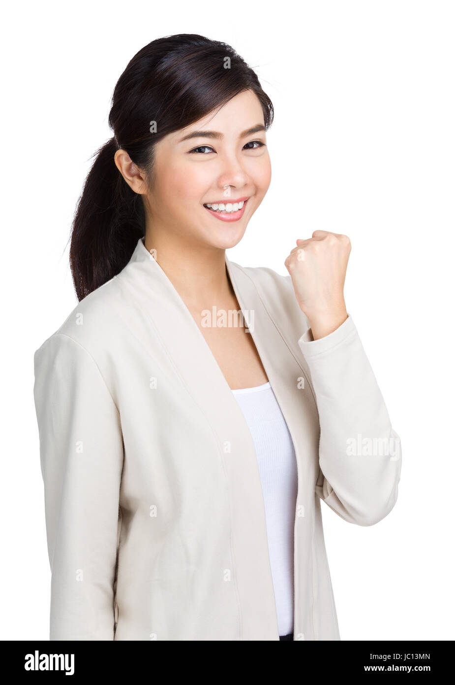 Young woman with fist up Stock Photo - Alamy