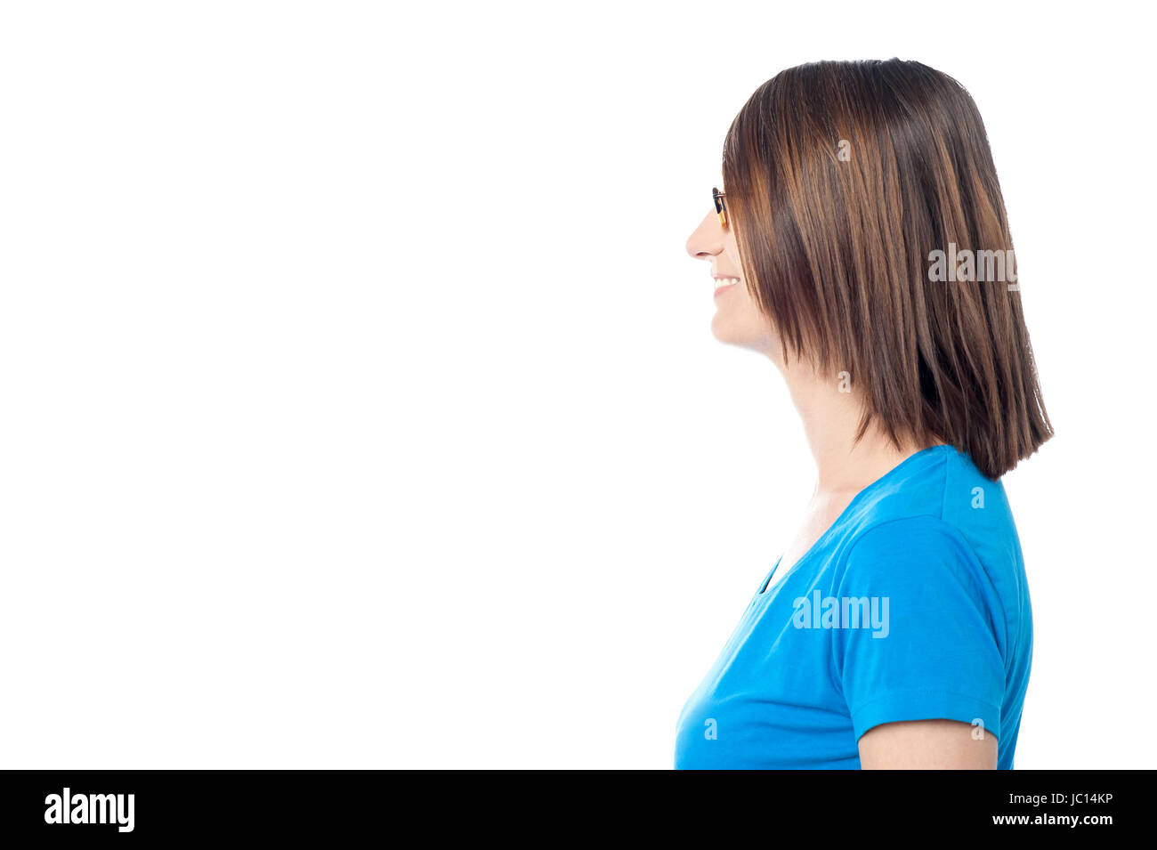 Side view of a casual woman smiling, isolated on white Stock Photo - Alamy
