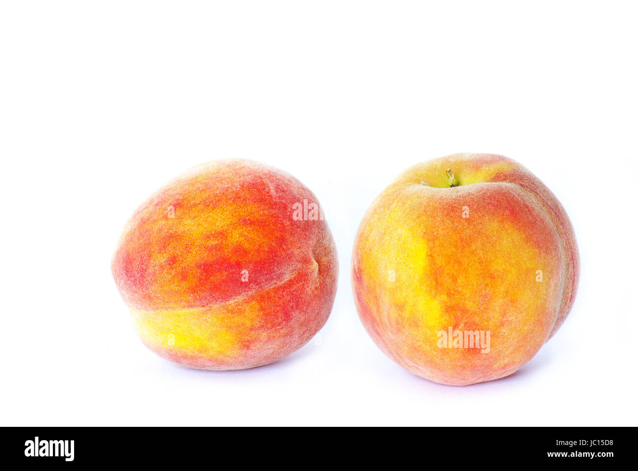 two peach isolated on white Stock Photo - Alamy