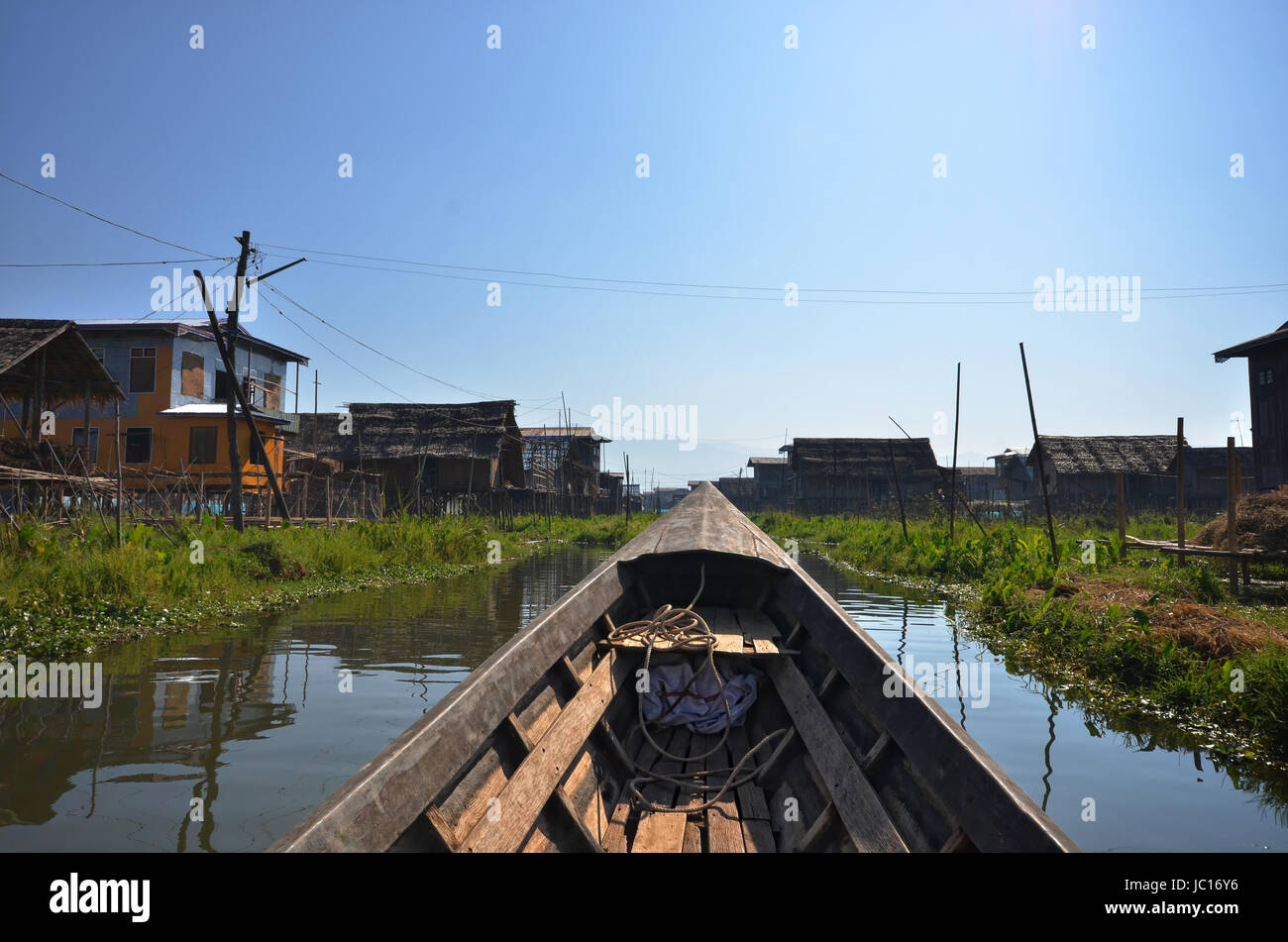 Traveling around floating village Inle Lake by small boat Stock Photo ...