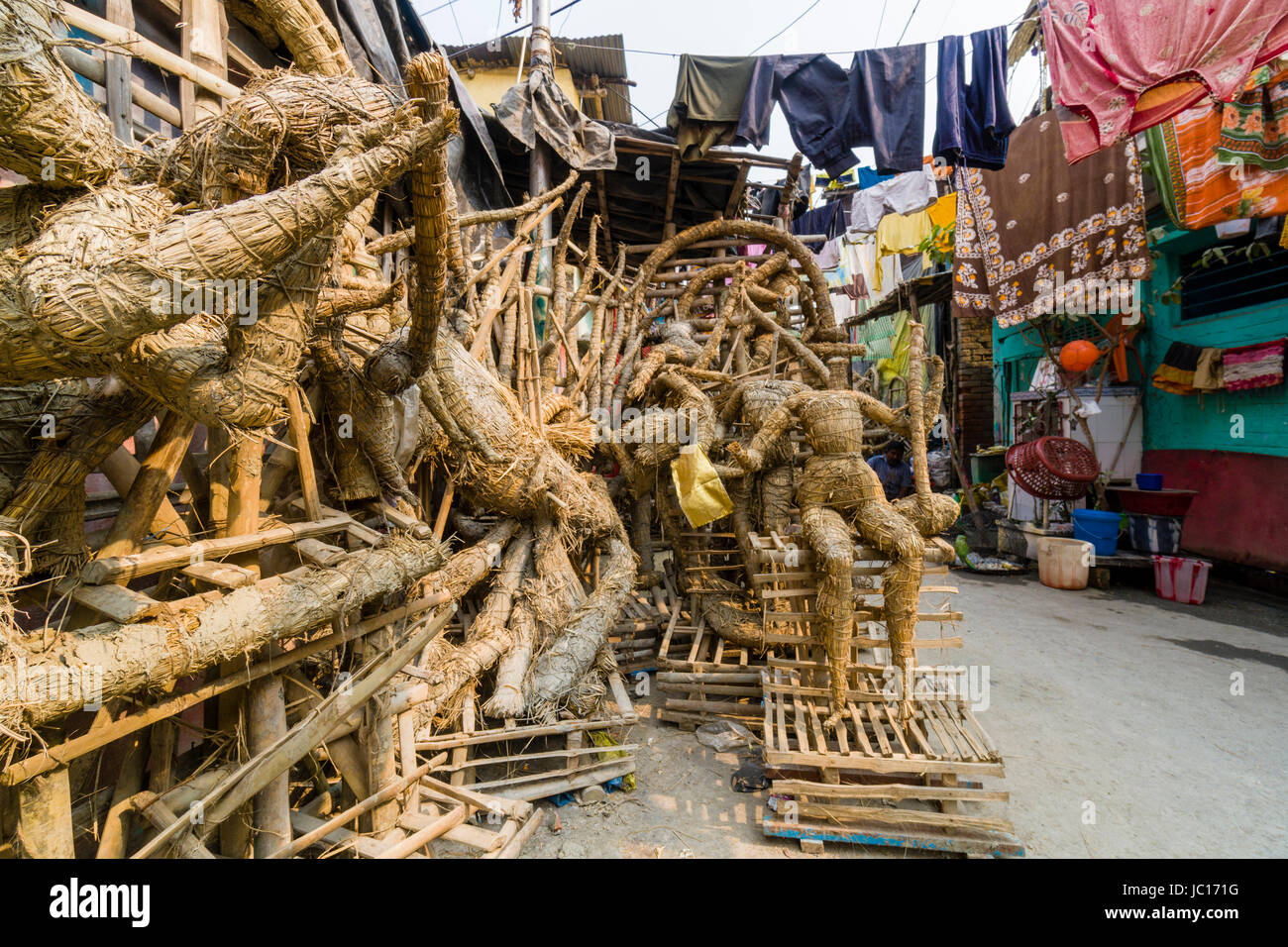 Statues for religious occasions are made by hand from straw and mud in ...