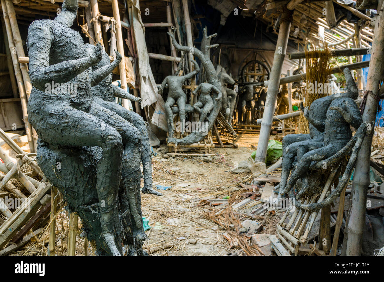 Statues for religious occasions are made by hand from straw and mud in ...