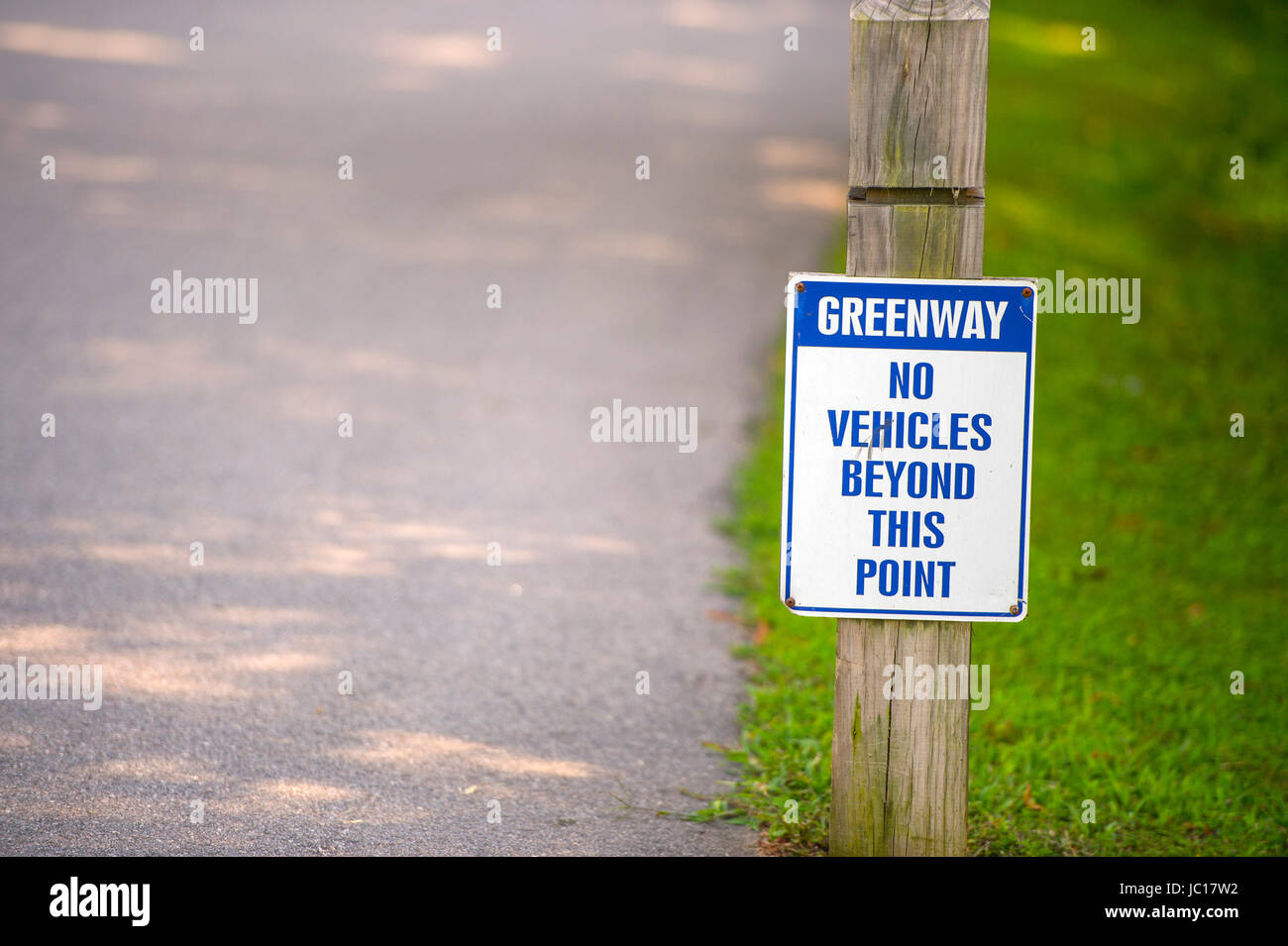 A sign board at a local park no vehicles allowed Stock Photo - Alamy