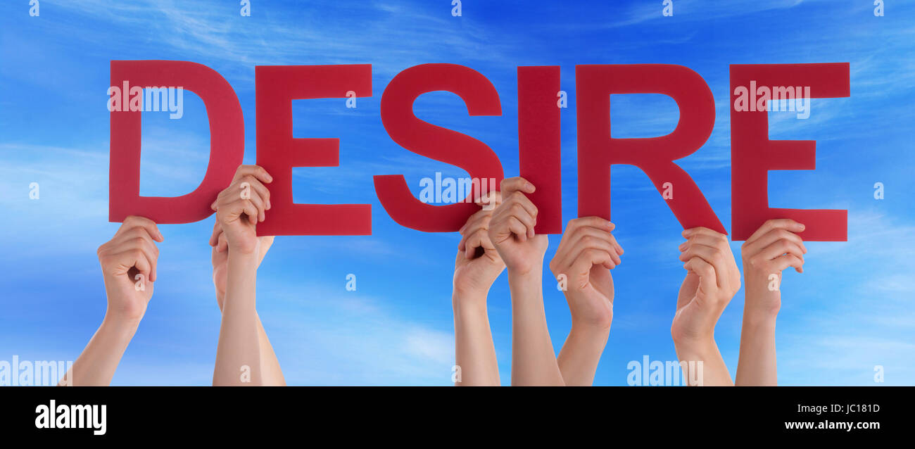 Many People Holding the Red Word Desire in the Sky Stock Photo - Alamy