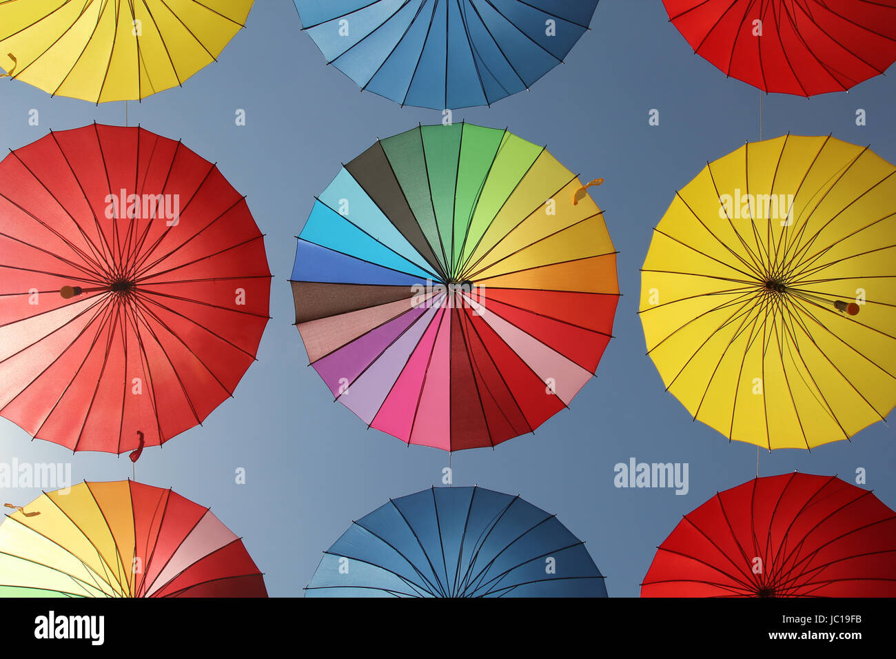 Rainbow parasols hi-res stock photography and images - Alamy