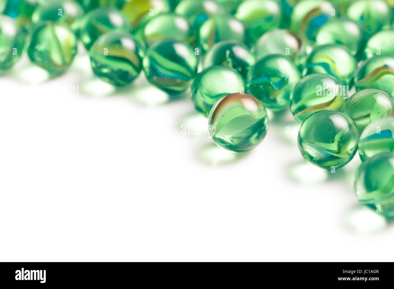 Glass marble balls on white background Stock Photo - Alamy