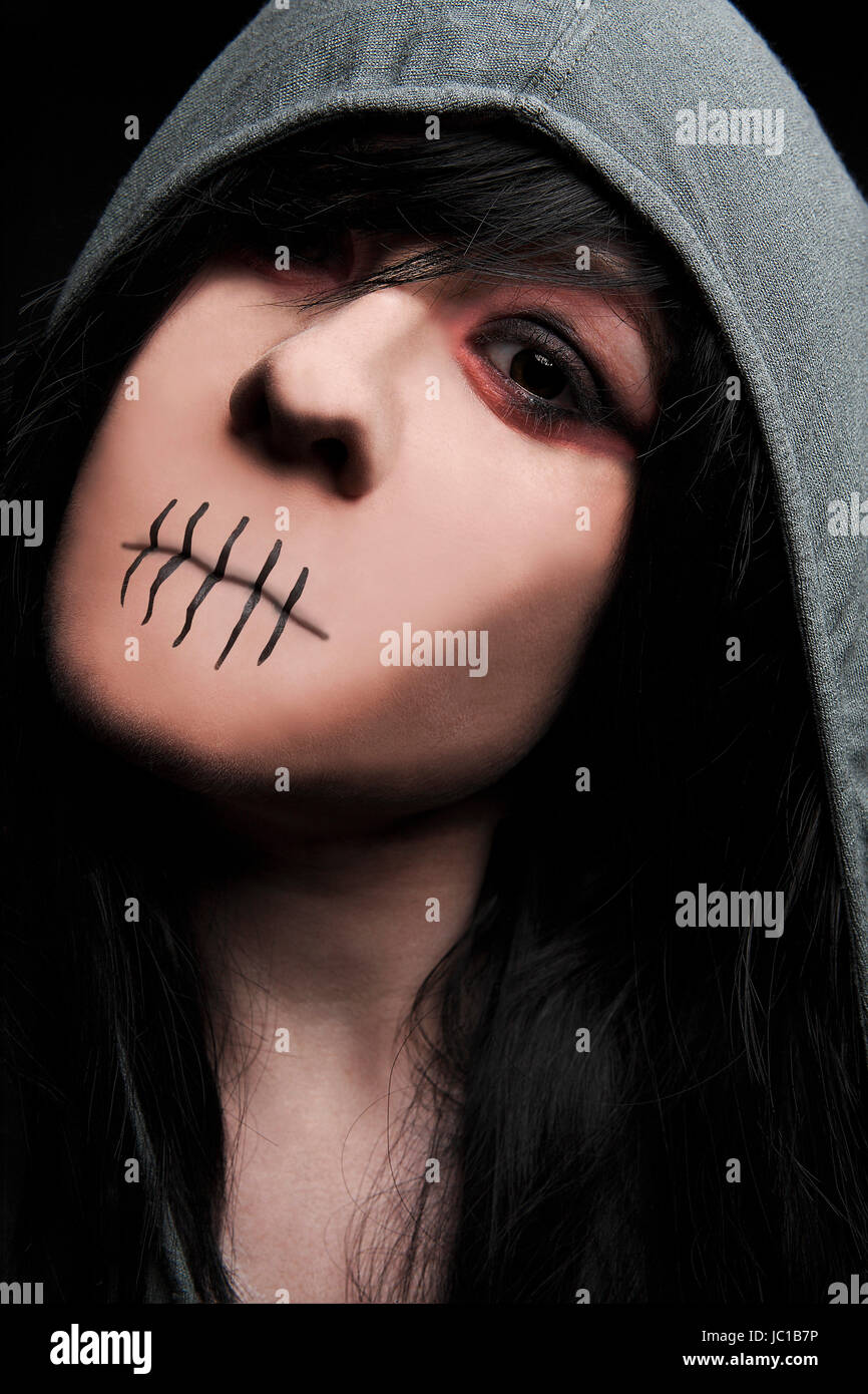 Female zombie without mouth looks into the camera Stock Photo - Alamy