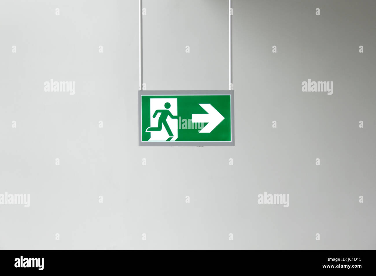 Closeup of modern illuminated emergency exit sign Stock Photo - Alamy