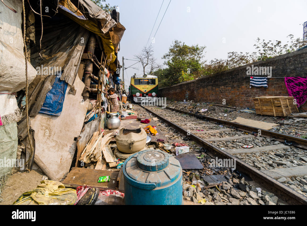 The dwellings and huts in China Bazar slum area are located right next ...