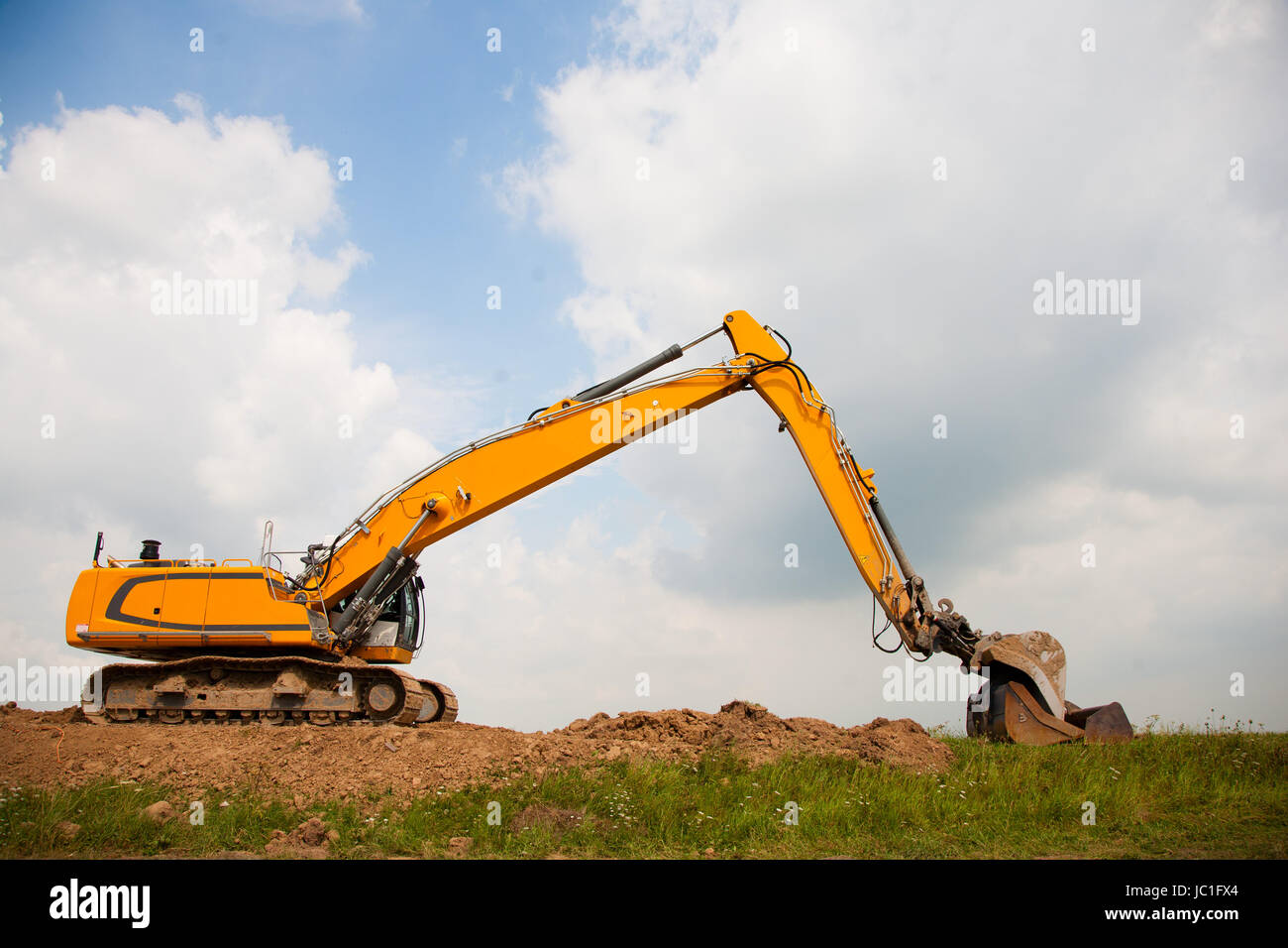 Excavator building a dike in the Netherlands Stock Photo - Alamy