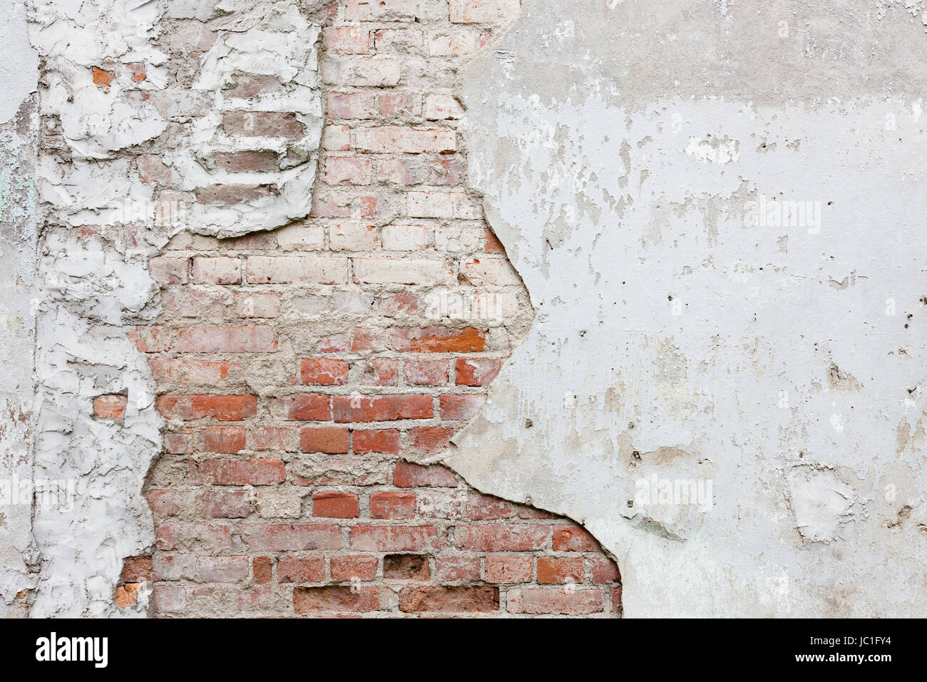 Aged brick wall with cracked plaster background Stock Photo - Alamy
