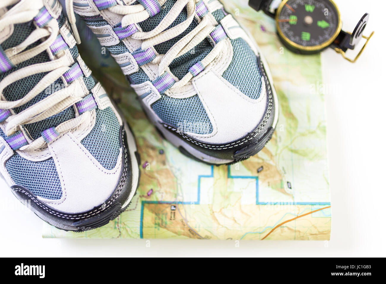 Pair of new womens hiking shoes with topo map on a white background ...