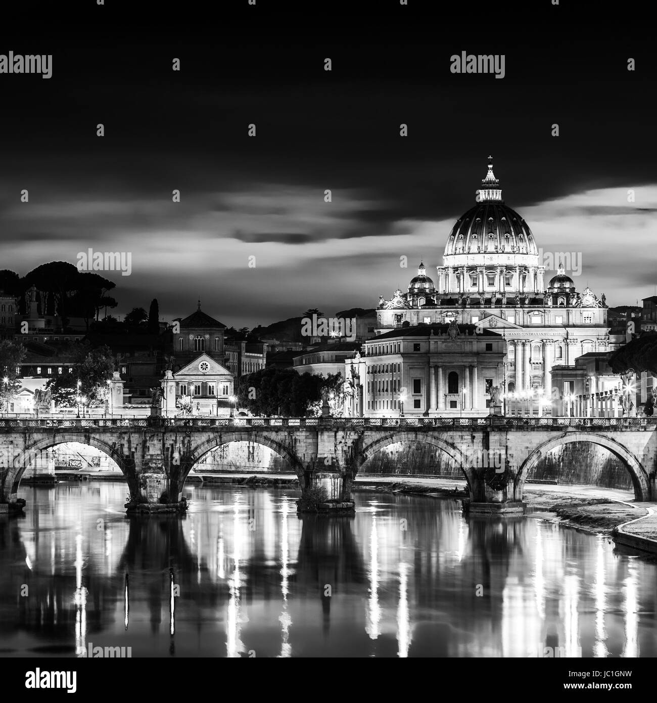 Night view of old roman Bridge of Hadrian and St. Peter's cathedral in ...