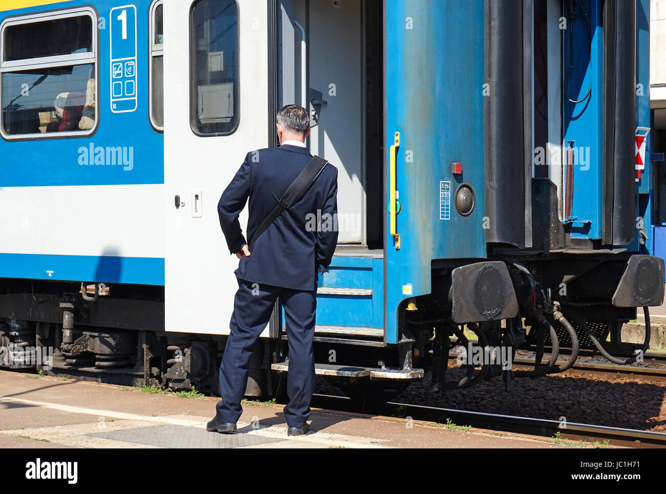 Train conductor at carriage hi-res stock photography and images - Alamy