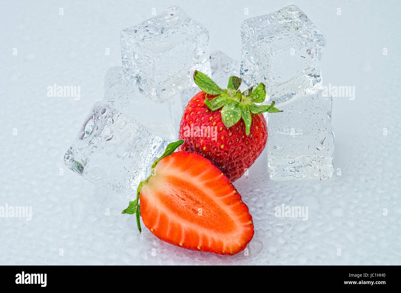 Strawberries with ice cubes Stock Photo - Alamy