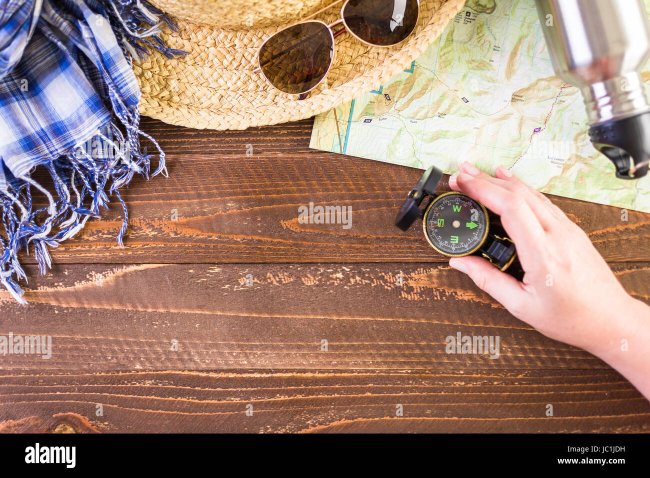 Topo map with compass for weekend hiking on a wood background Stock ...