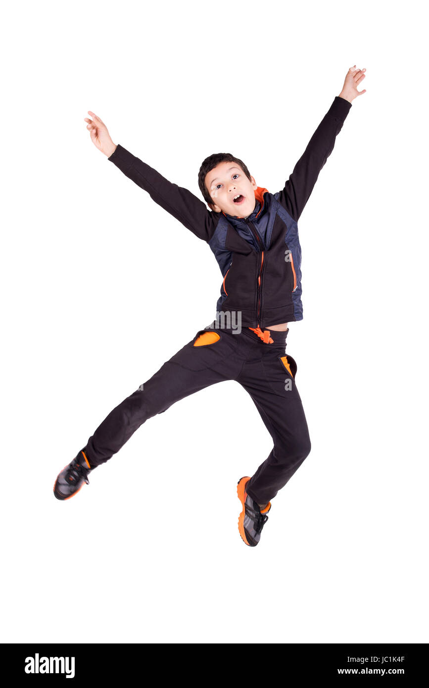 Young boy jumping isolated in white Stock Photo - Alamy