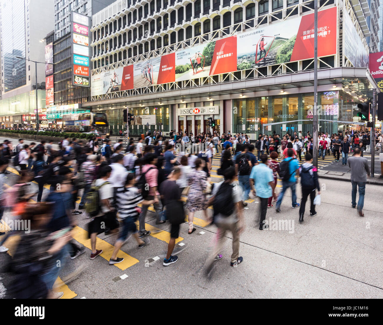 HONG KONG - APRIL 26, 2017: People, captured with blurred motion, cross ...