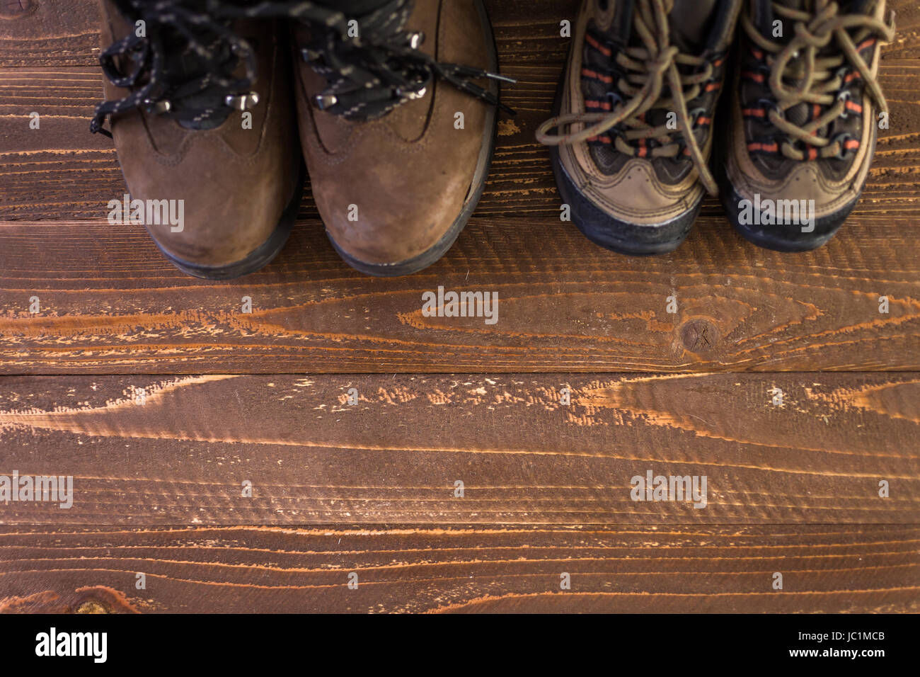 Hiking shoes with topo map and compass on a wood background Stock Photo ...