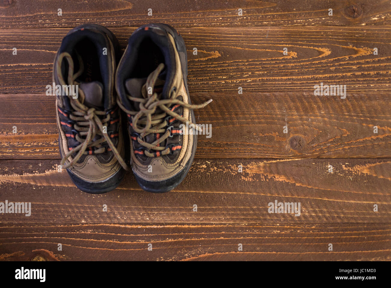 Hiking shoes with topo map and compass on a wood background Stock Photo ...