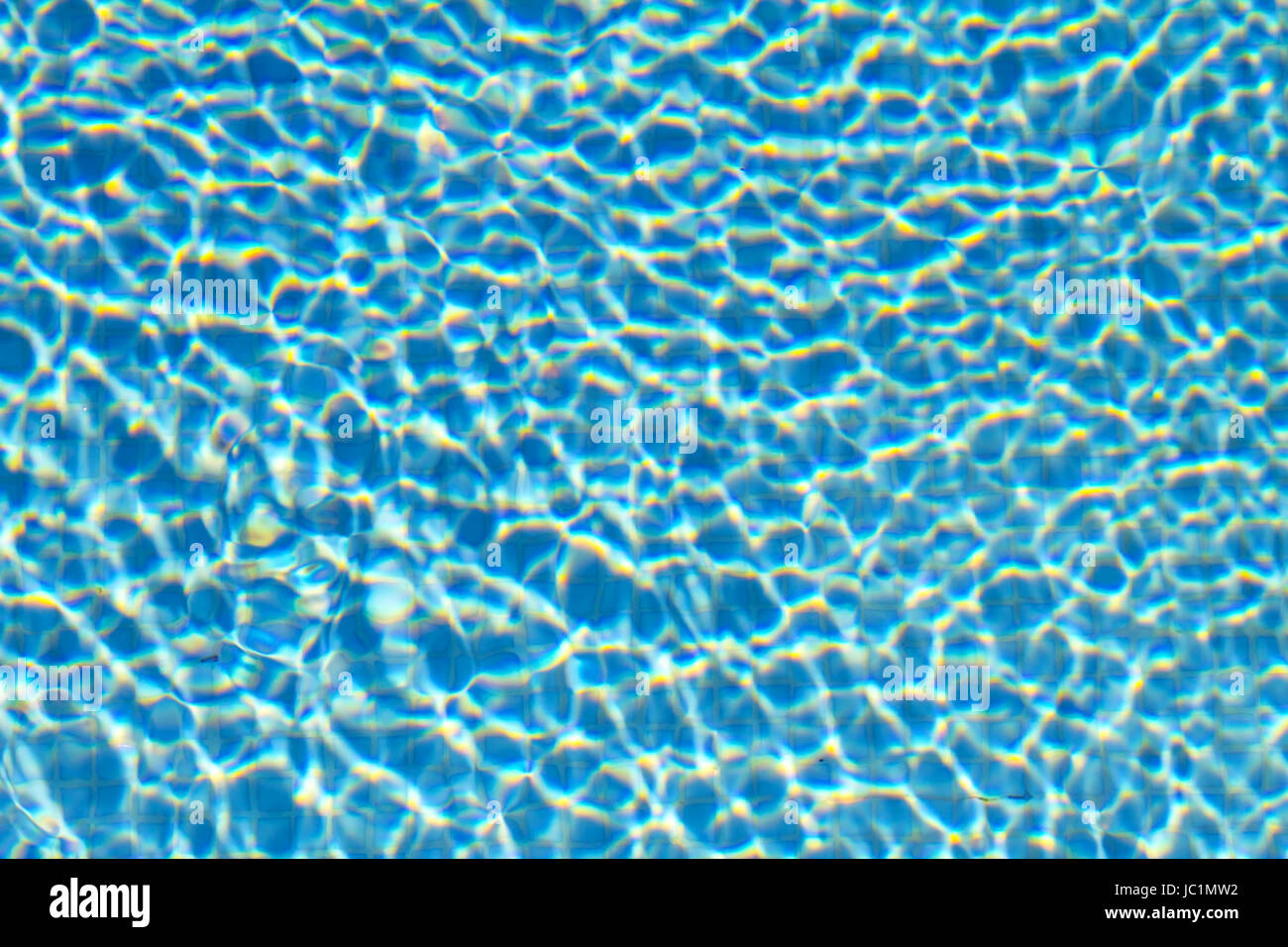 Water on a tiled swimming pool background Stock Photo - Alamy