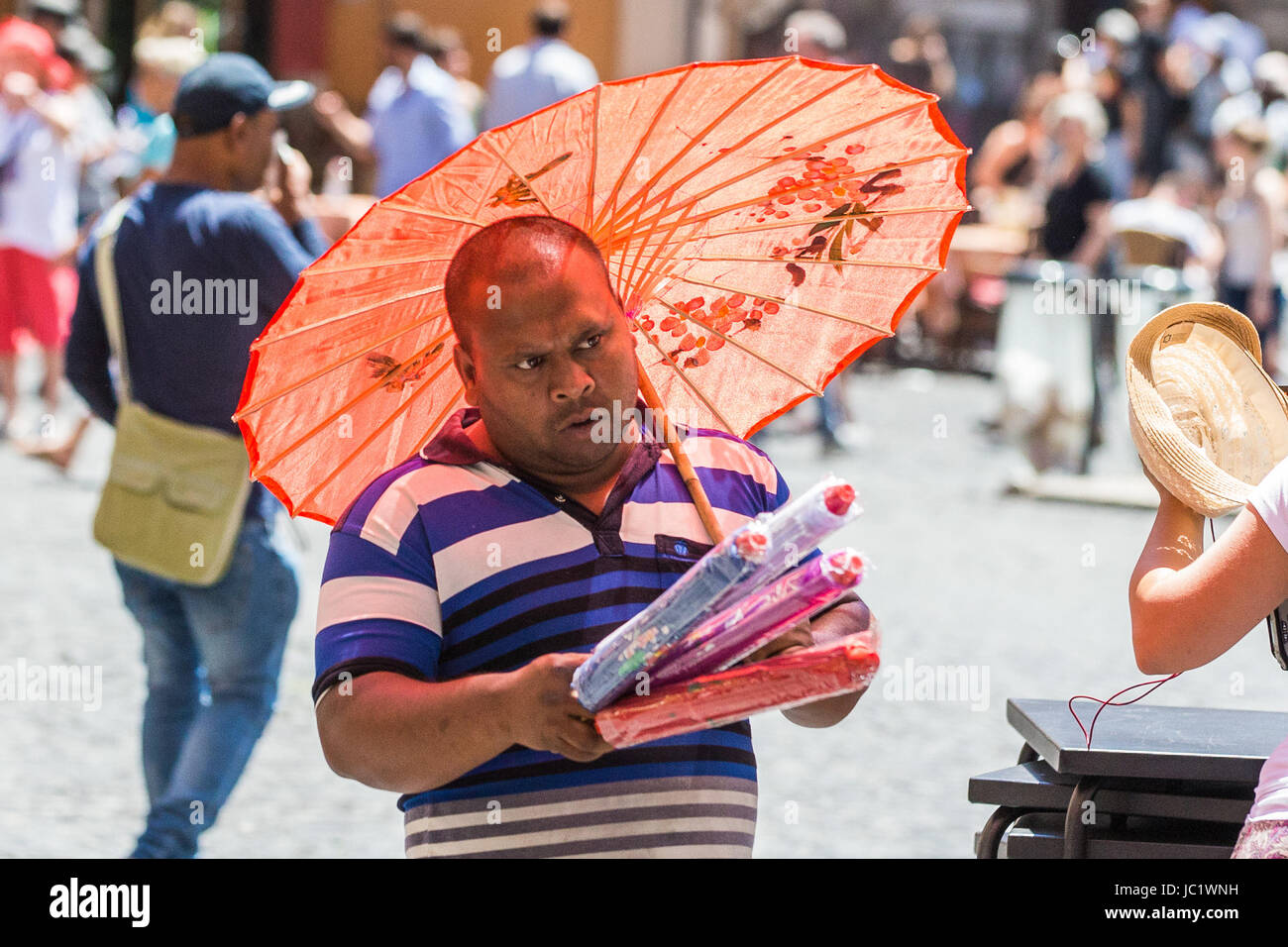 June 12, 2017 - An umbrella street salesman scolds a fellow street ...