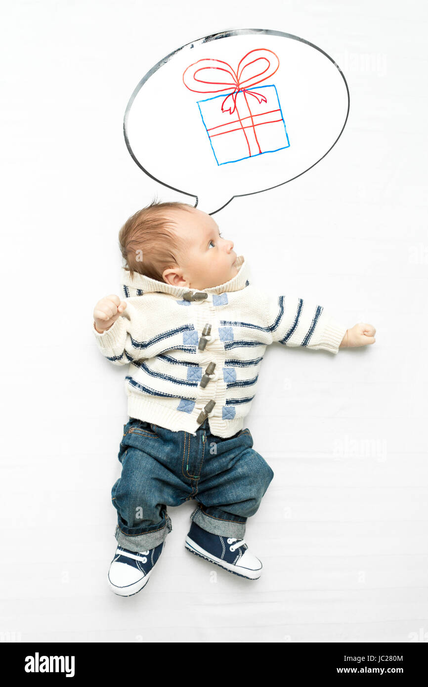 Isolated photo of cute little baby boy dreaming of present Stock Photo ...