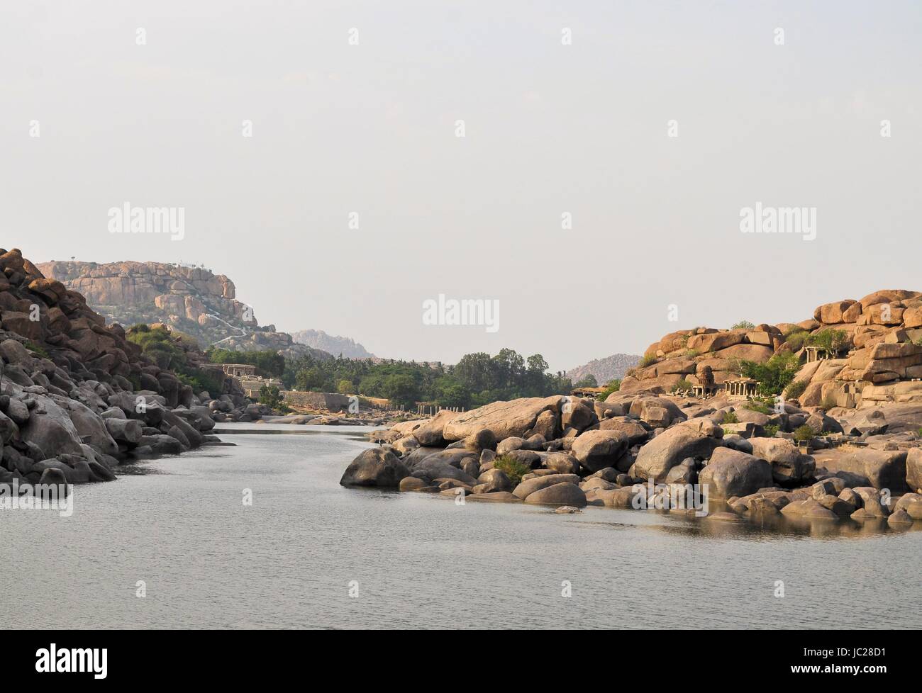 Ancient ruins of Vijayanagara Empire at sunset blue sky in Hampi ...