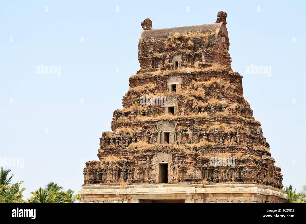 Ancient partiallyovergrown ruins of Vijayanagara Empire at sunset blue ...