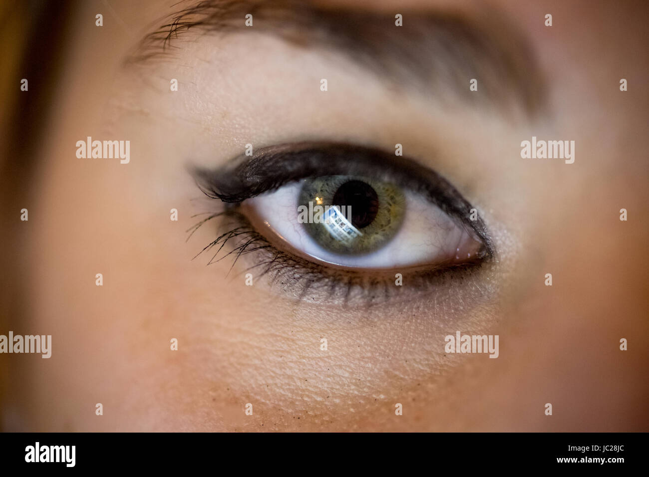 Closeup photo of female eye with computer screen reflecting in it Stock ...