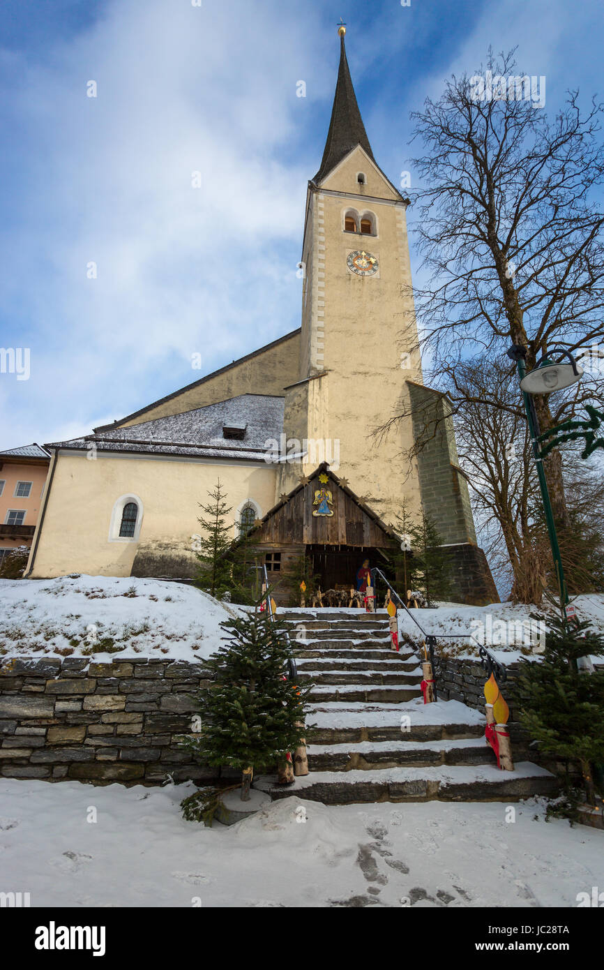 Old stone church with high belfry in Austrian Alps Stock Photo - Alamy
