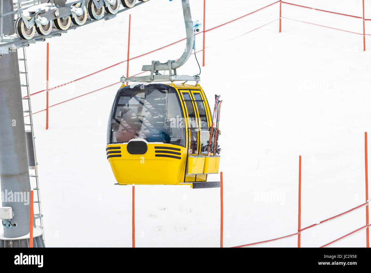 Photo of yellow cable car on Alpine ski slope Stock Photo - Alamy