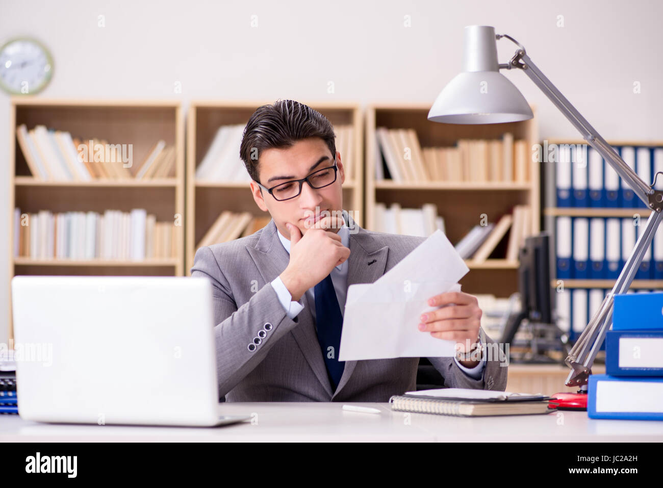 Businessman receiving letter in the office Stock Photo - Alamy