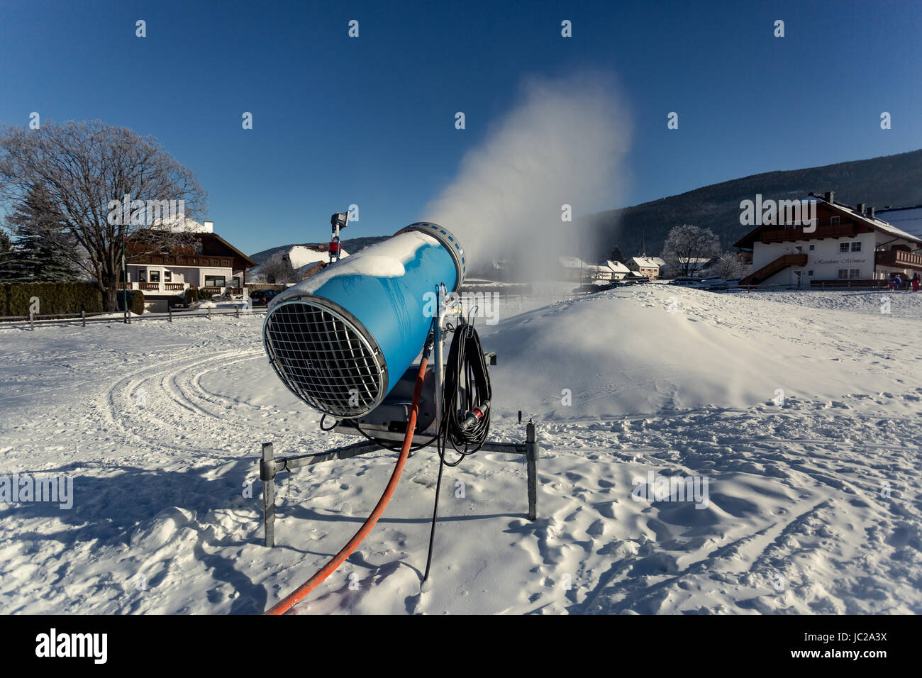 Big snow cannon making snow on ski resort at Alps Stock Photo - Alamy
