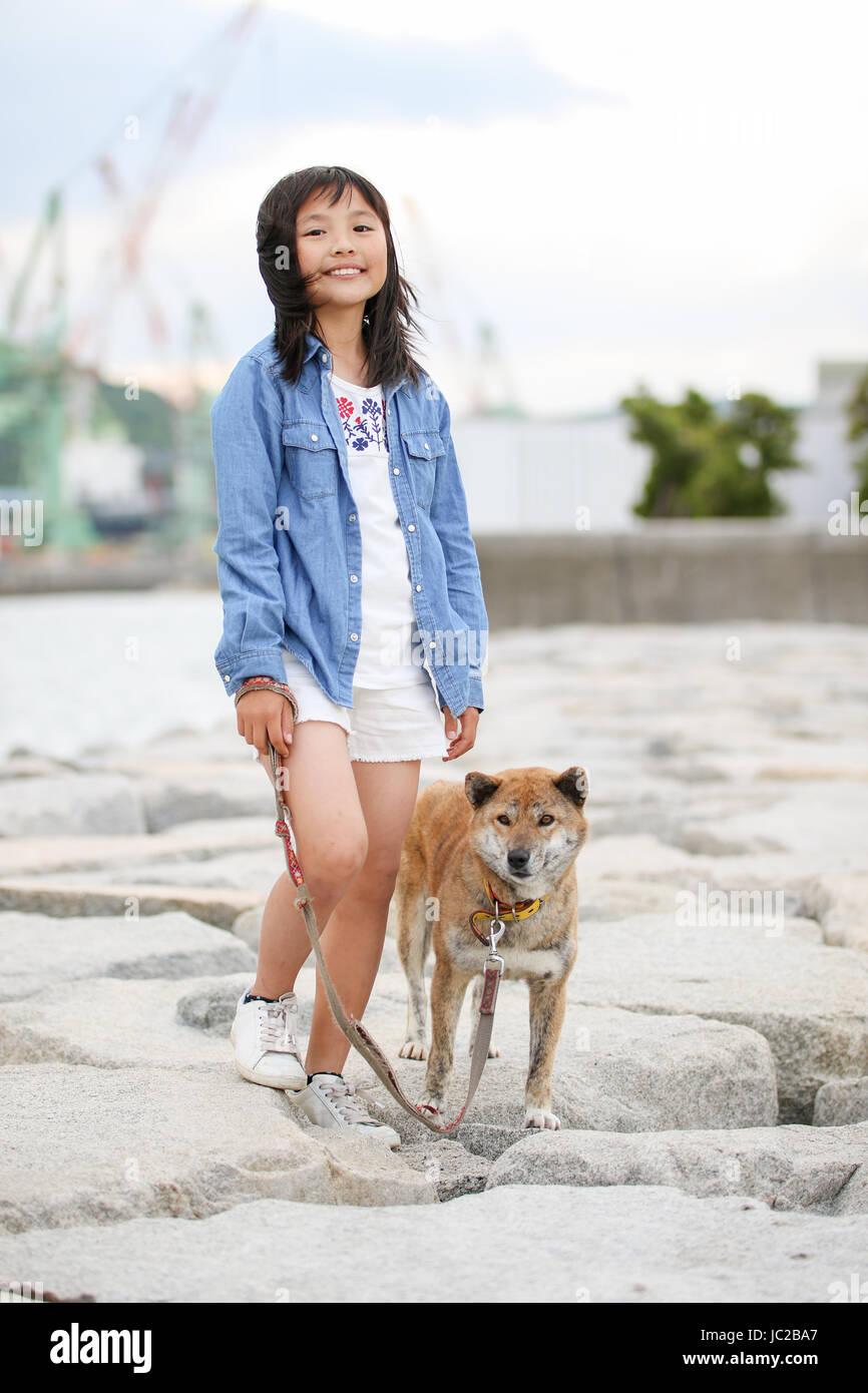 Girl and Shiba Inu Stock Photo - Alamy