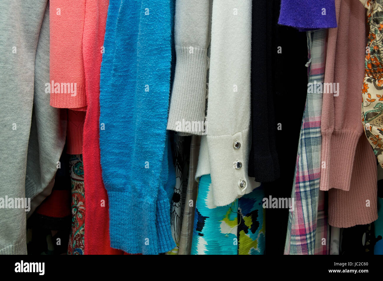 Close up of woman's clothing hanging in closet, showing various ...