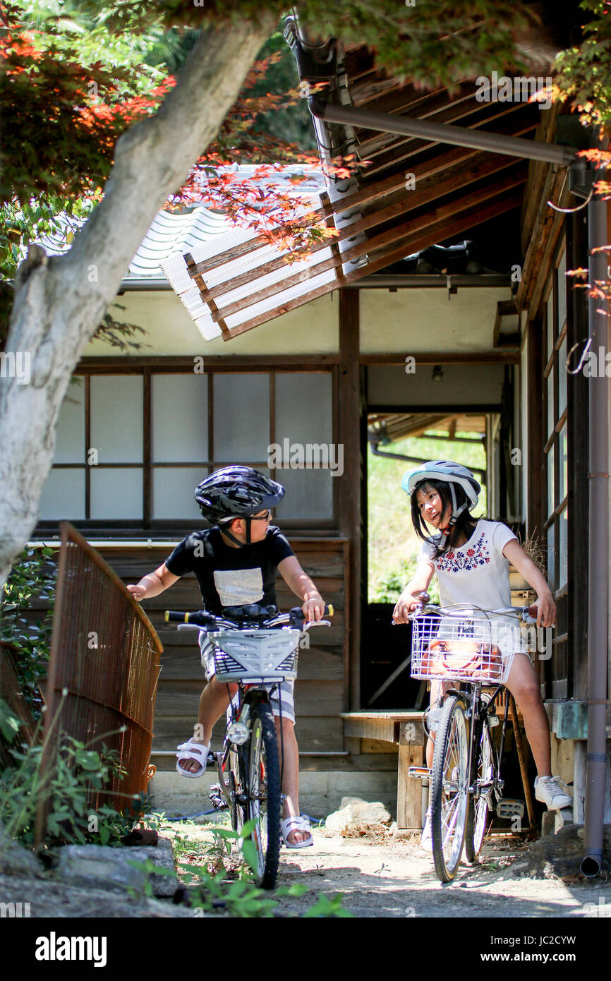 Cycling boy girl hi-res stock photography and images - Alamy