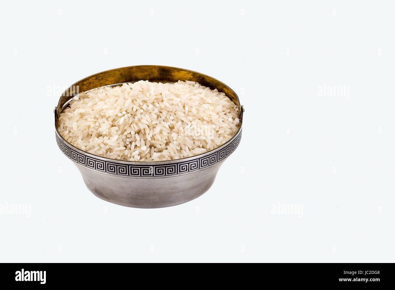 White rice in rare silver pial isolated on white background Stock Photo ...