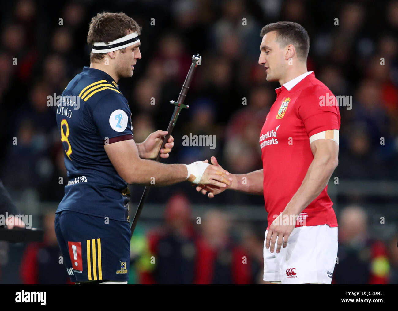Highlanders captain Luke Whitelock presents a claymore sword to British ...