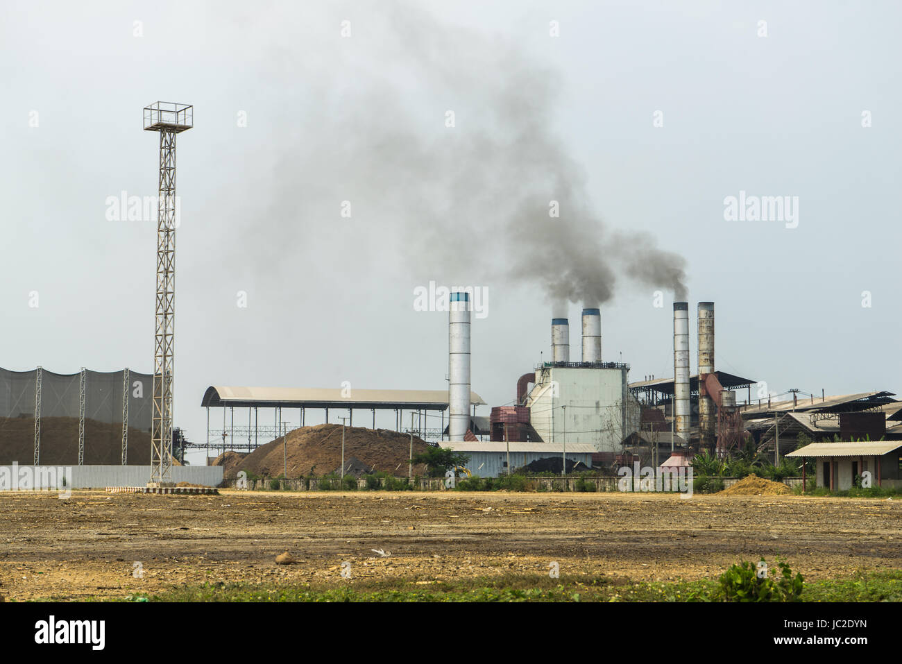 Chemical factory with smoke stack Stock Photo - Alamy
