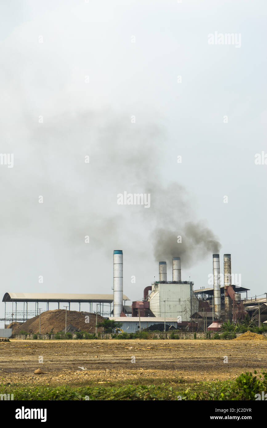 Chemical factory with smoke stack Stock Photo - Alamy