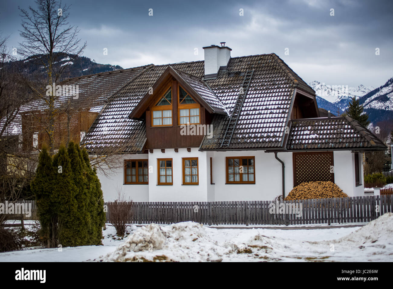 Traditional wooden house in Austrian Alps at snowy day Stock Photo - Alamy