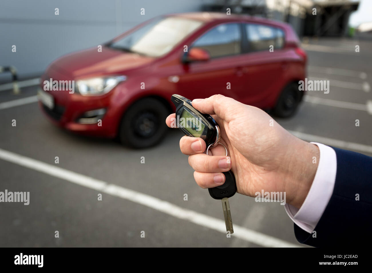 Closeup shot of man opening car with remote alarm key Stock Photo - Alamy