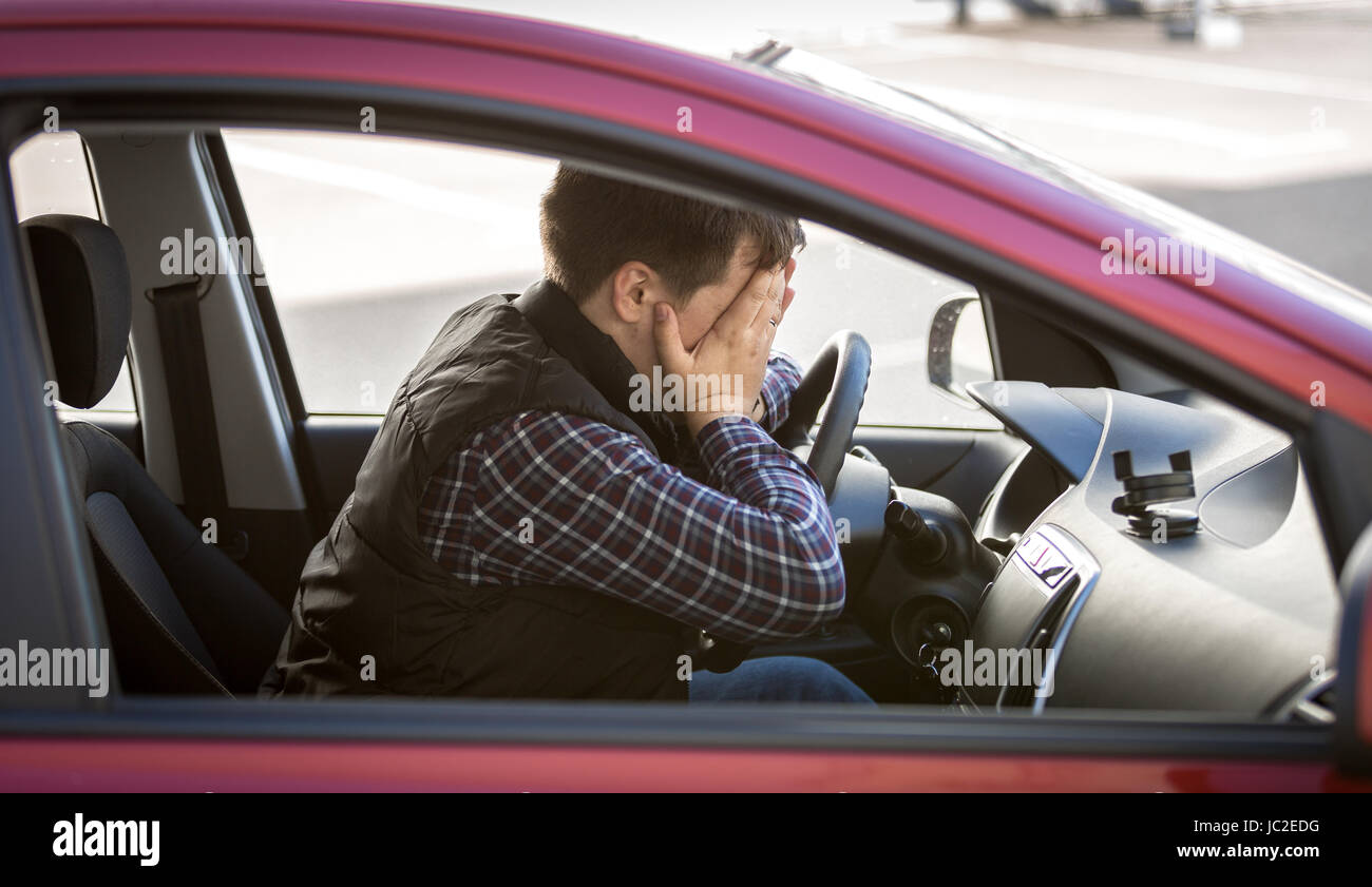 Closeup portrait of shocked male driver closing face with hands Stock ...